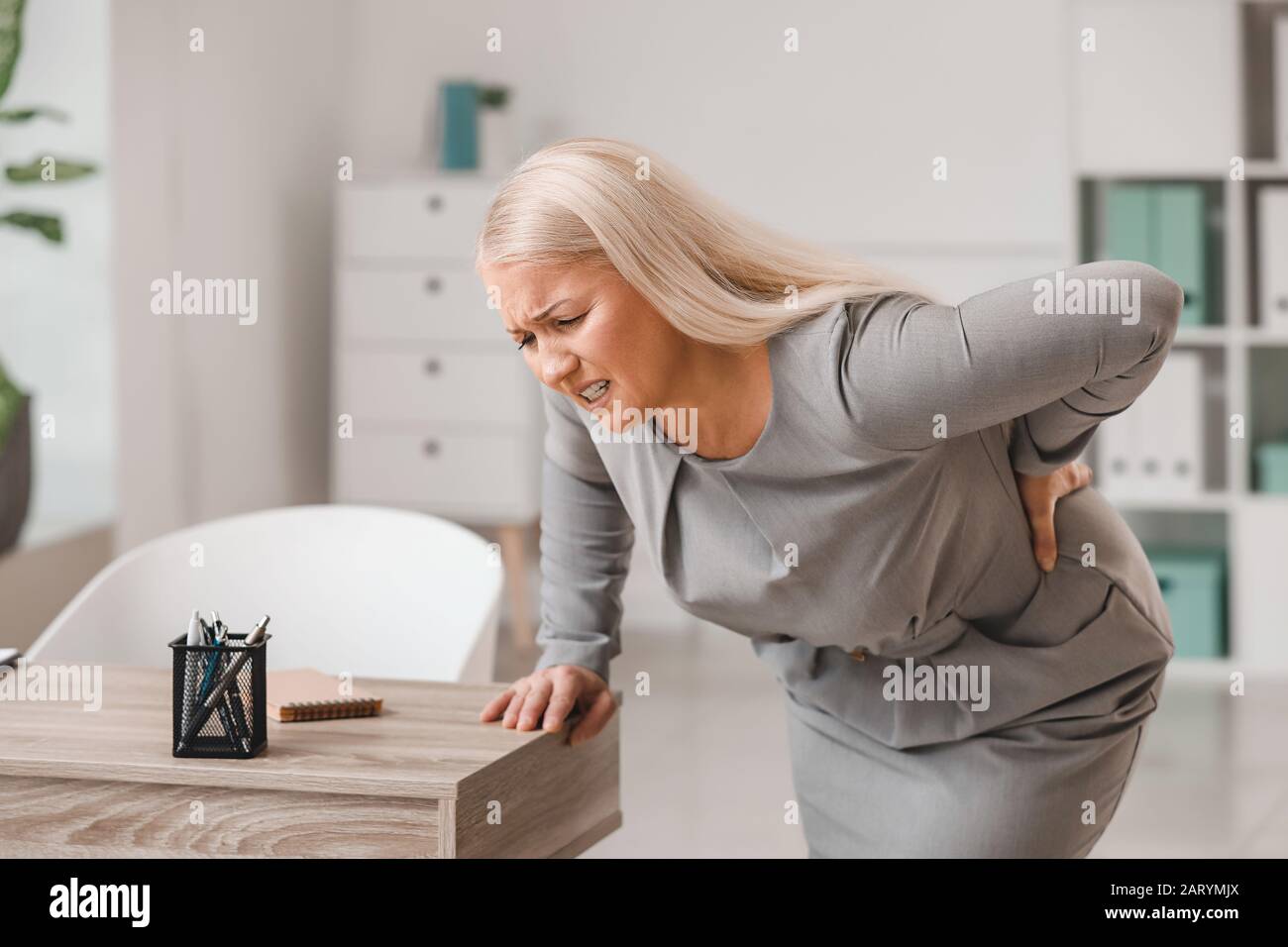Low back pain work hi-res stock photography and images - Alamy