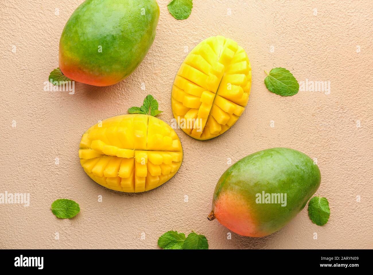 Sweet ripe mangoes on color background Stock Photo - Alamy