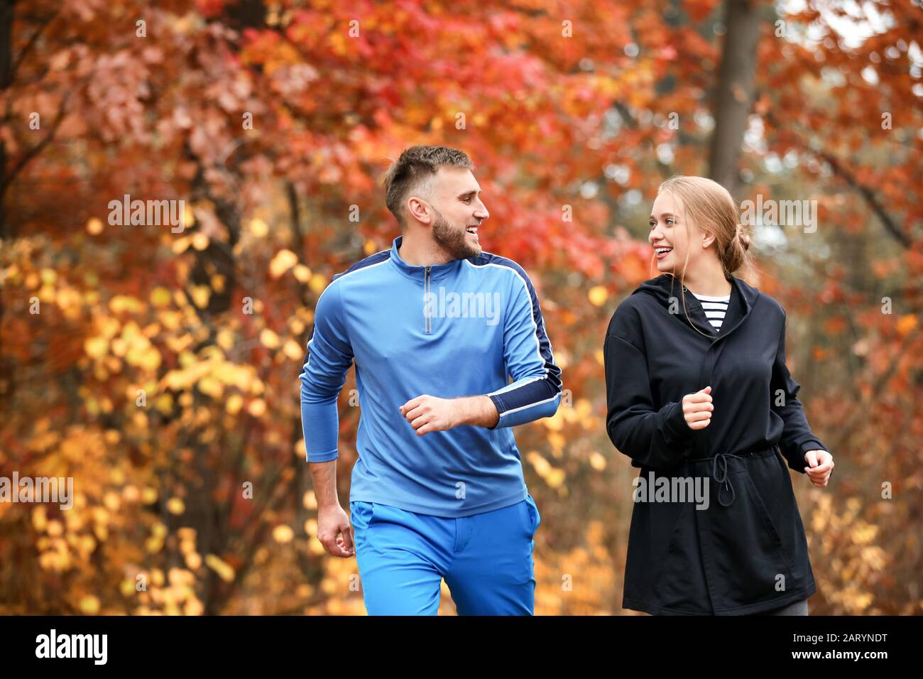 Young fitness couple running forest hi-res stock photography and images ...