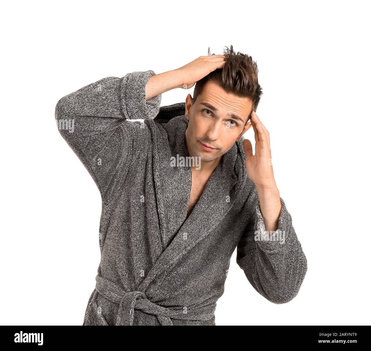 Handsome man in bathrobe on white background Stock Photo - Alamy