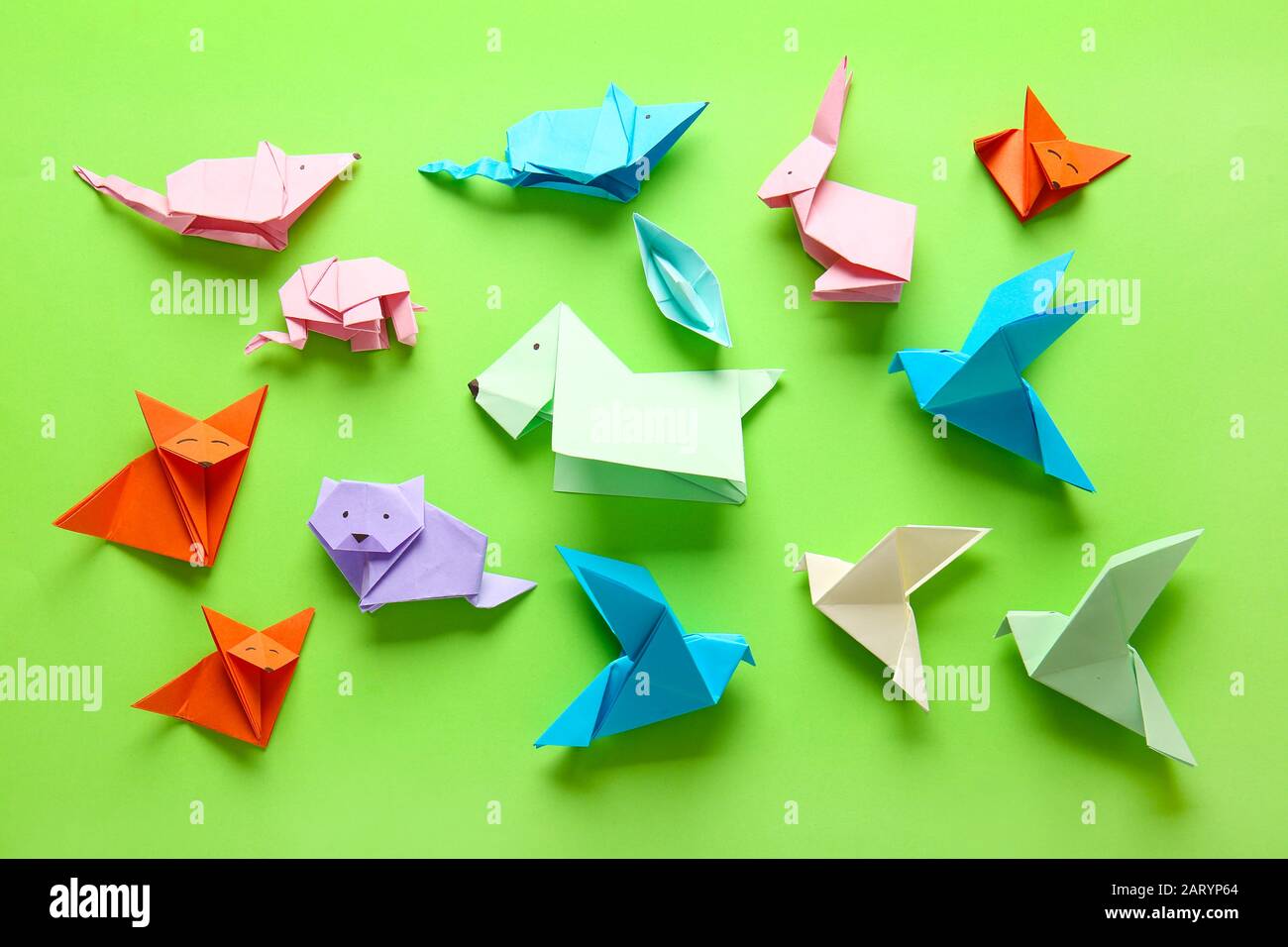 Many origami figures on color background Stock Photo - Alamy