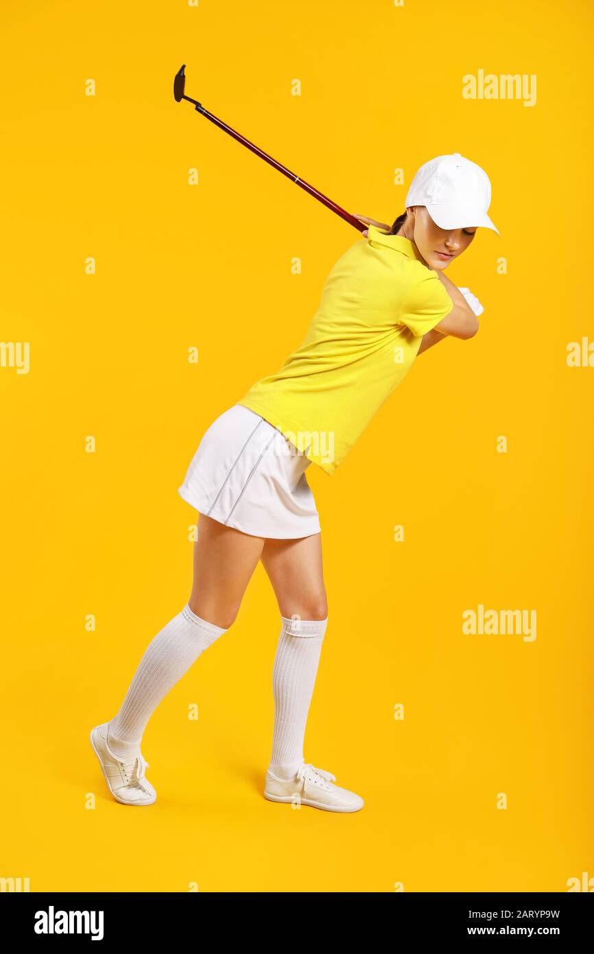 Beautiful female golfer on color background Stock Photo - Alamy