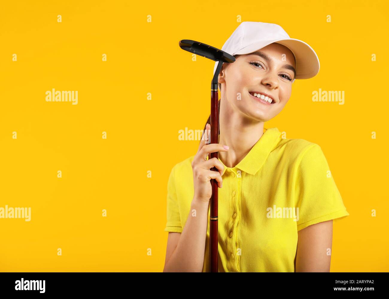 Beautiful female golfer on color background Stock Photo - Alamy