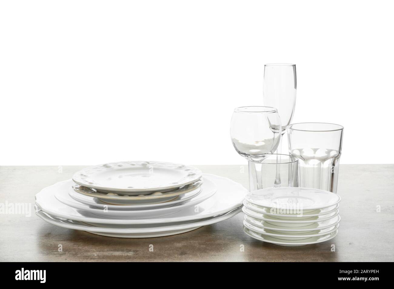 Set of clean tableware on white background Stock Photo - Alamy