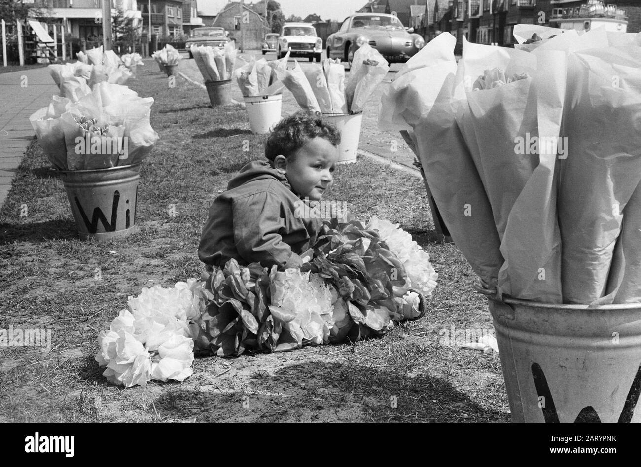 Two-year-old Michel sells in flower booth of father Date: May 10, 1962 ...