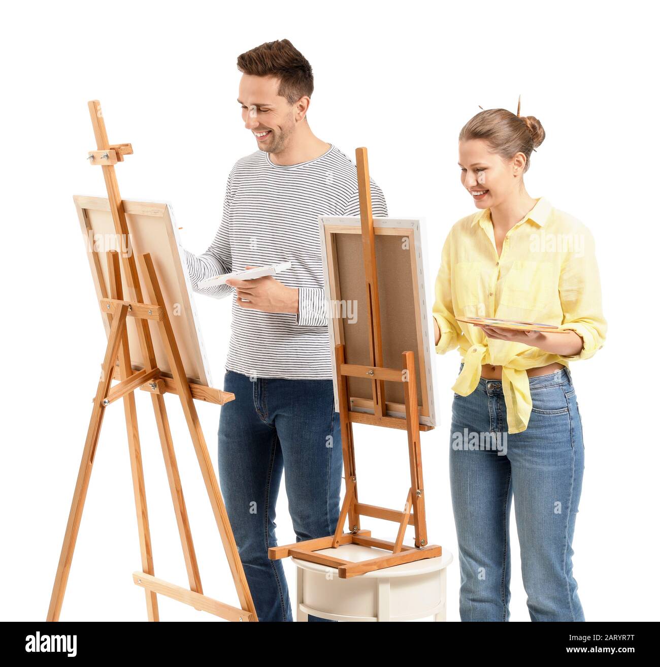 Young couple of artists isolated on white Stock Photo - Alamy