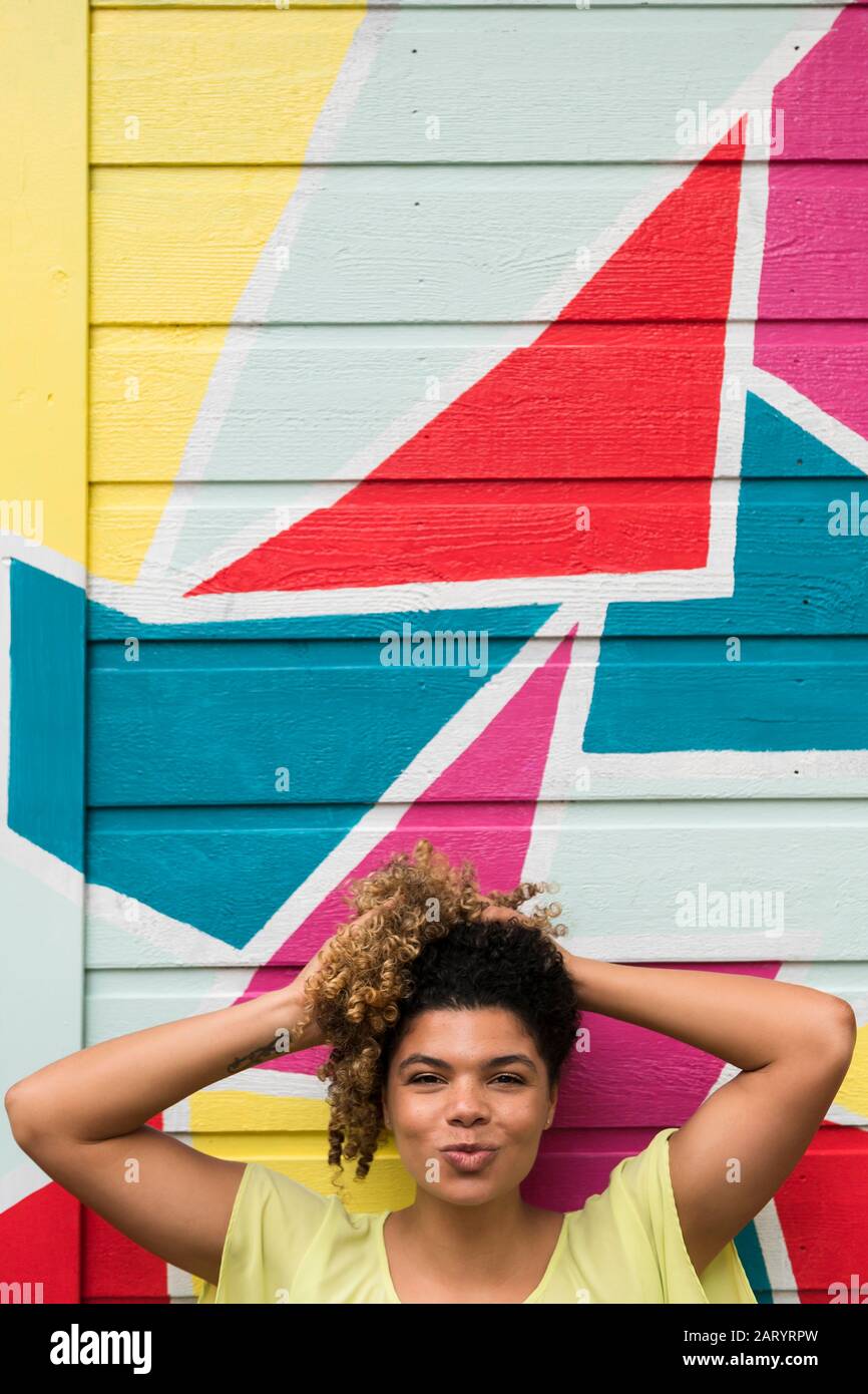 Woman curly hair posing outdoors hi-res stock photography and images ...