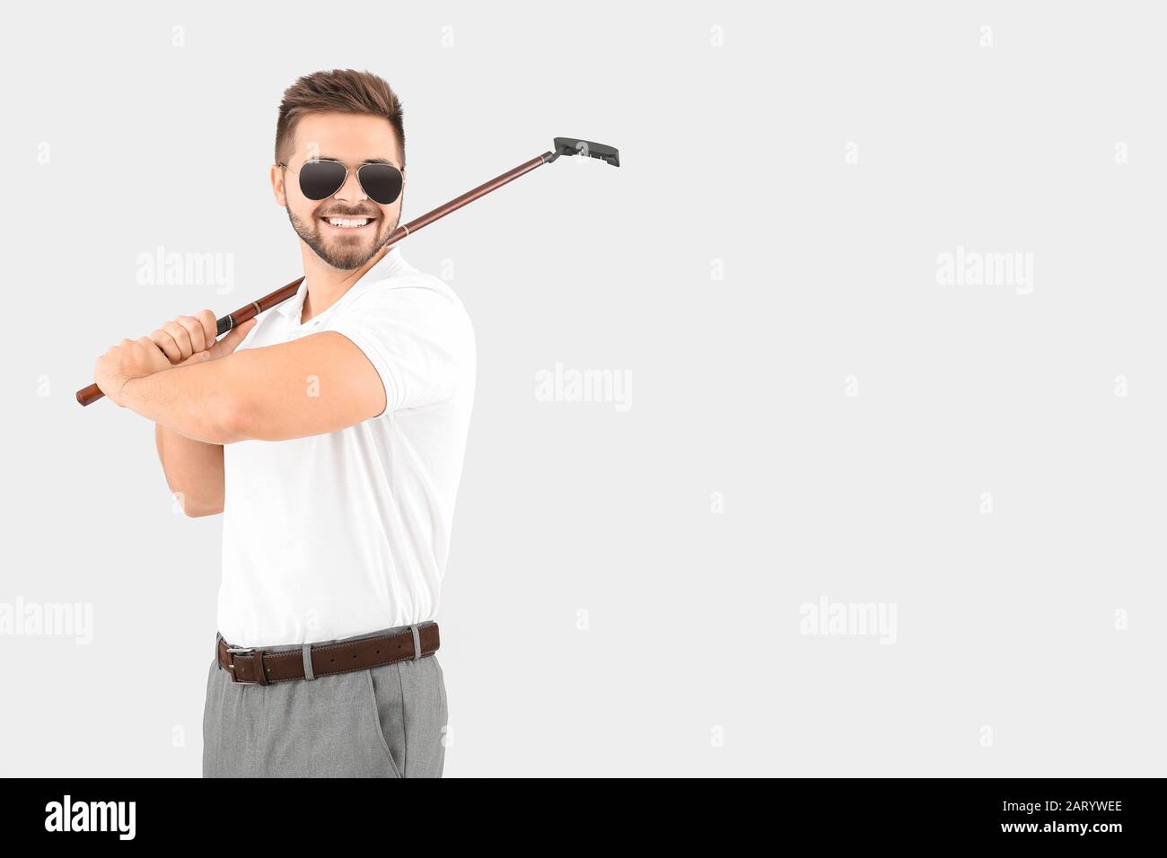 Handsome male golfer on white background Stock Photo - Alamy