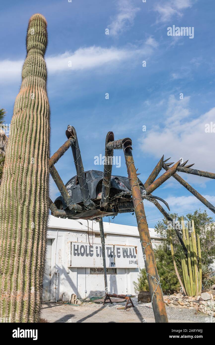 A gigantic spider sculpture made with welded parts including a ...