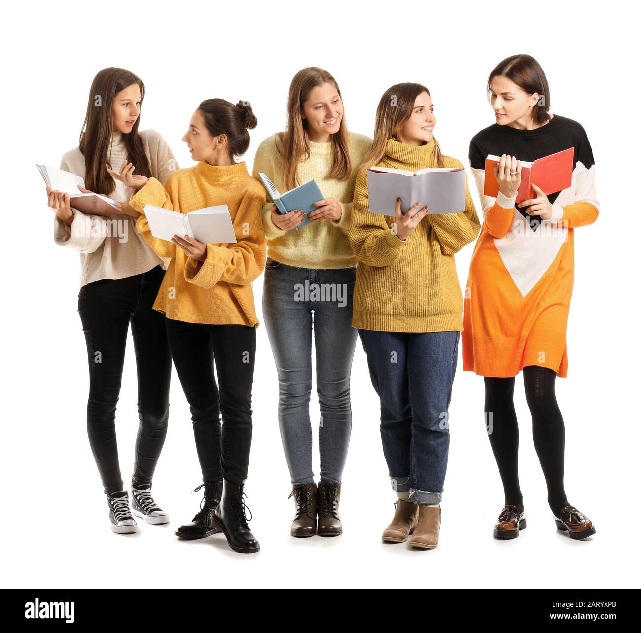 Young women with books on white background Stock Photo - Alamy