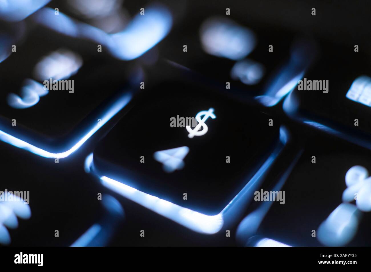 Illuminated dollar sign key on keyboard Stock Photo - Alamy