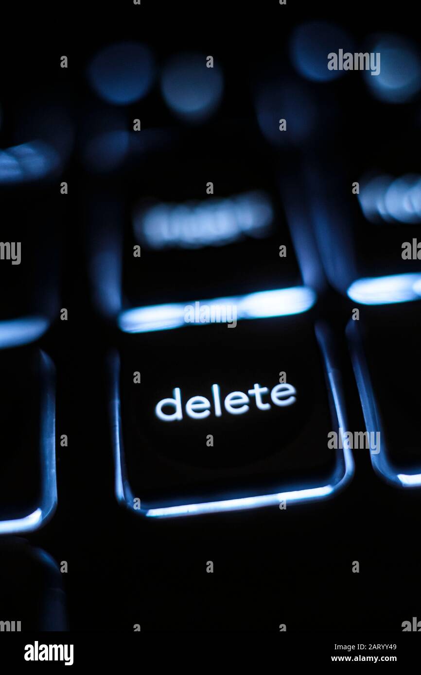 Illuminated 'delete' key on keyboard Stock Photo - Alamy