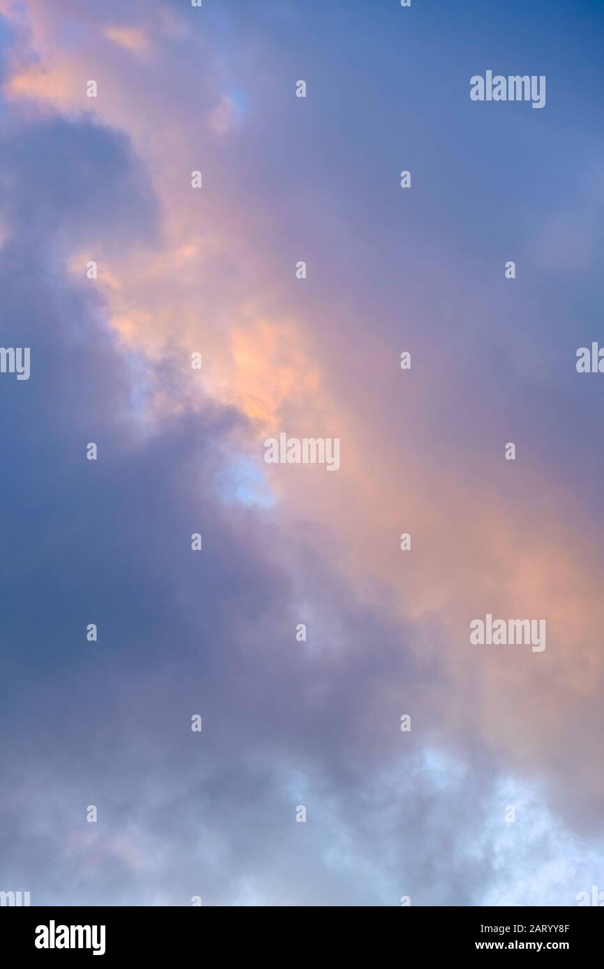 Pink clouds in blue sky Stock Photo - Alamy