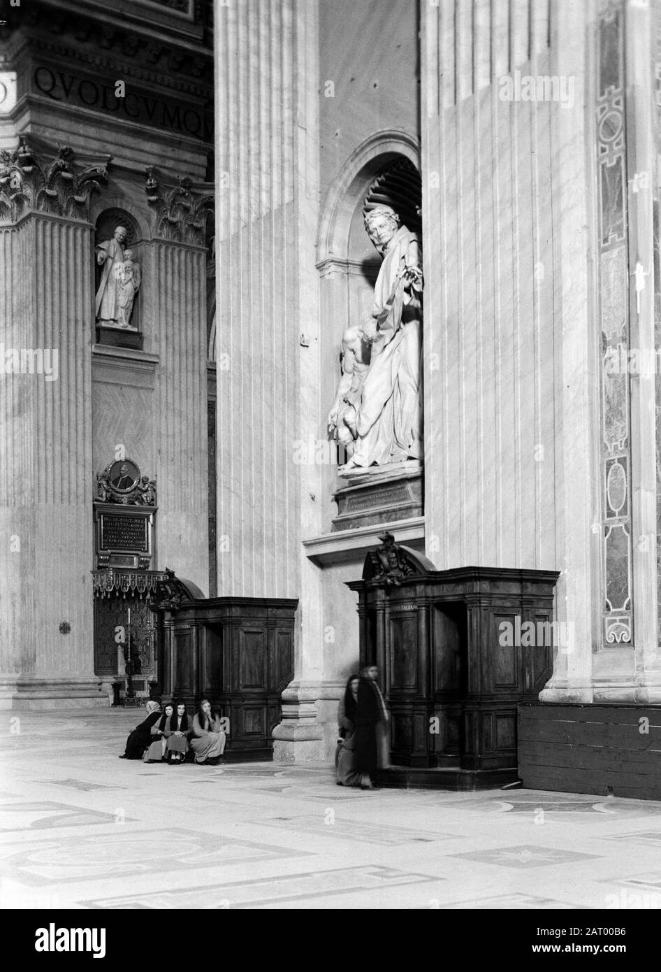 Rome: Visit to Vatican City Women sit at the foot of one of the ...