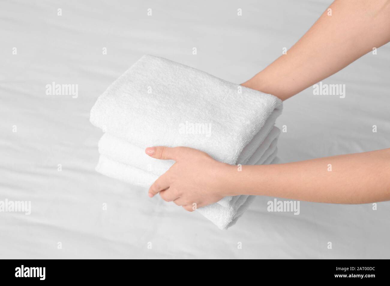 Woman putting stack soft hi-res stock photography and images - Alamy