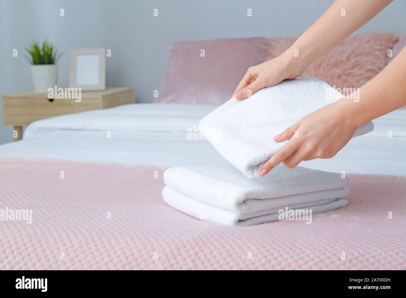 Woman putting stack soft hi-res stock photography and images - Alamy