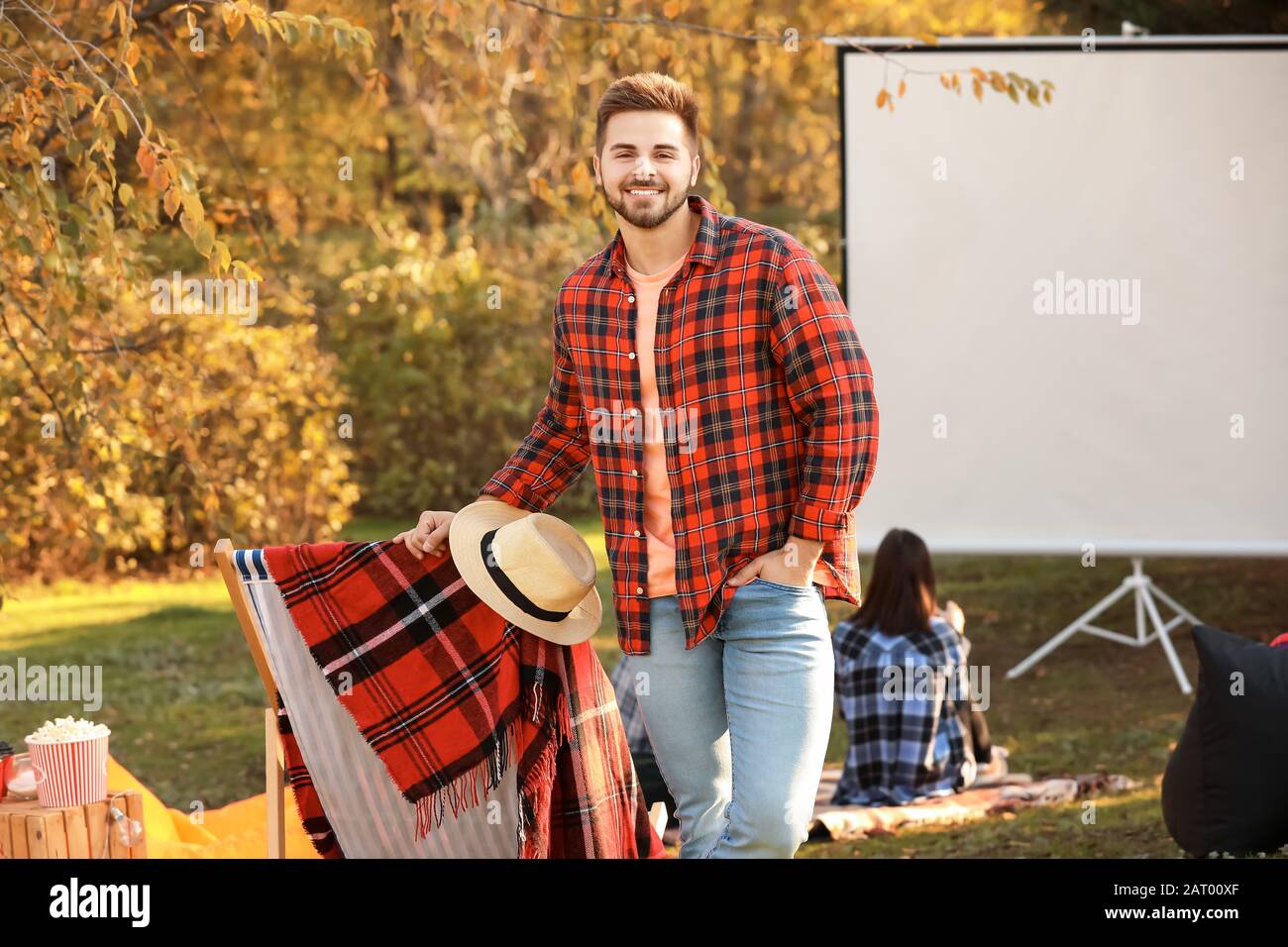 Young man in outdoor cinema Stock Photo - Alamy