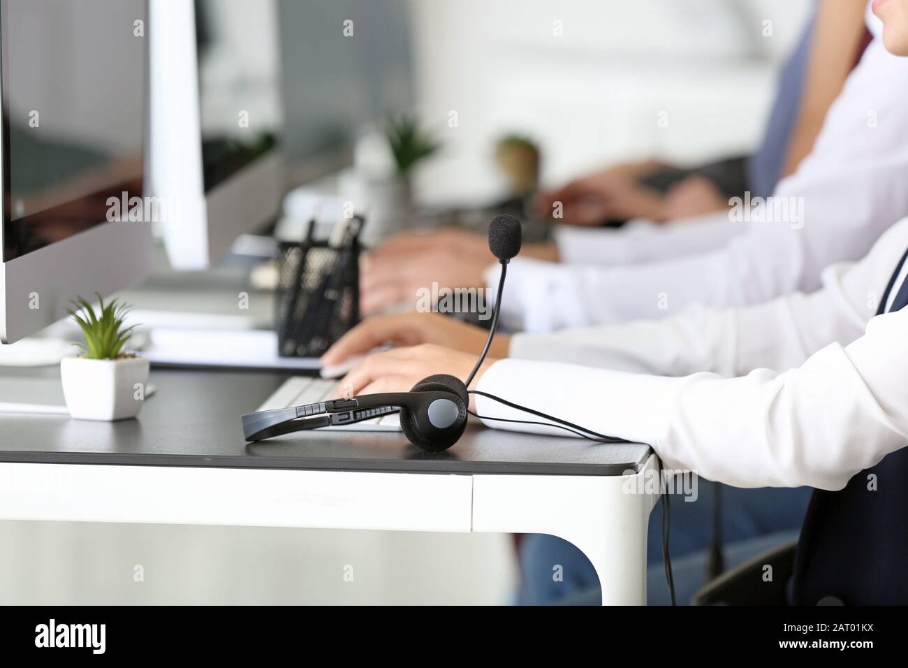Technical support agent working in office, closeup Stock Photo - Alamy