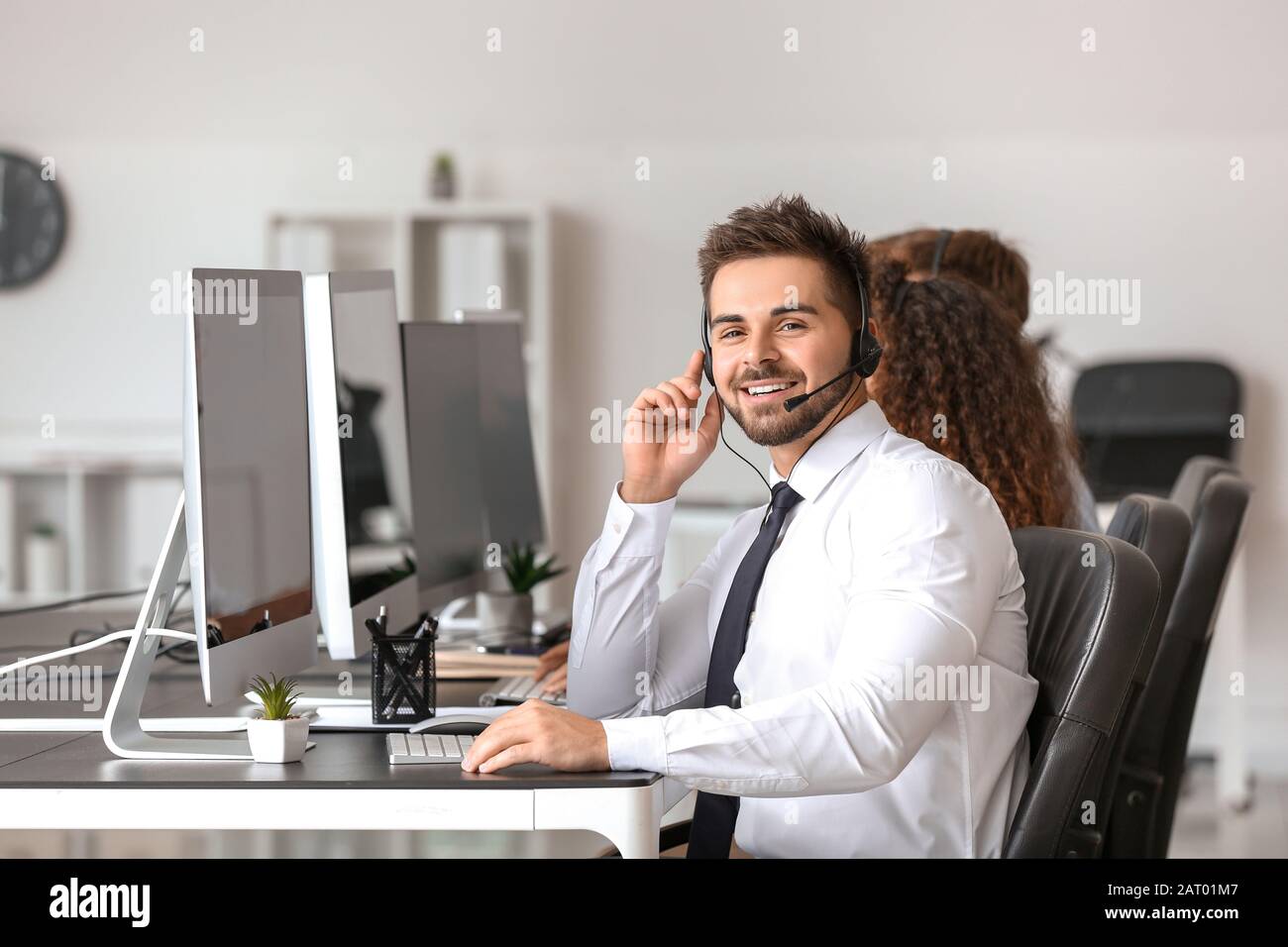 Technical support agents working in office Stock Photo - Alamy