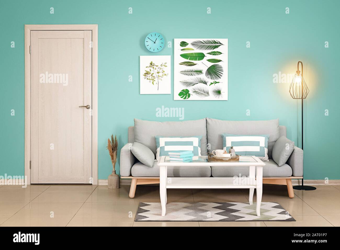 Interior of modern living room with turquoise elements Stock Photo - Alamy