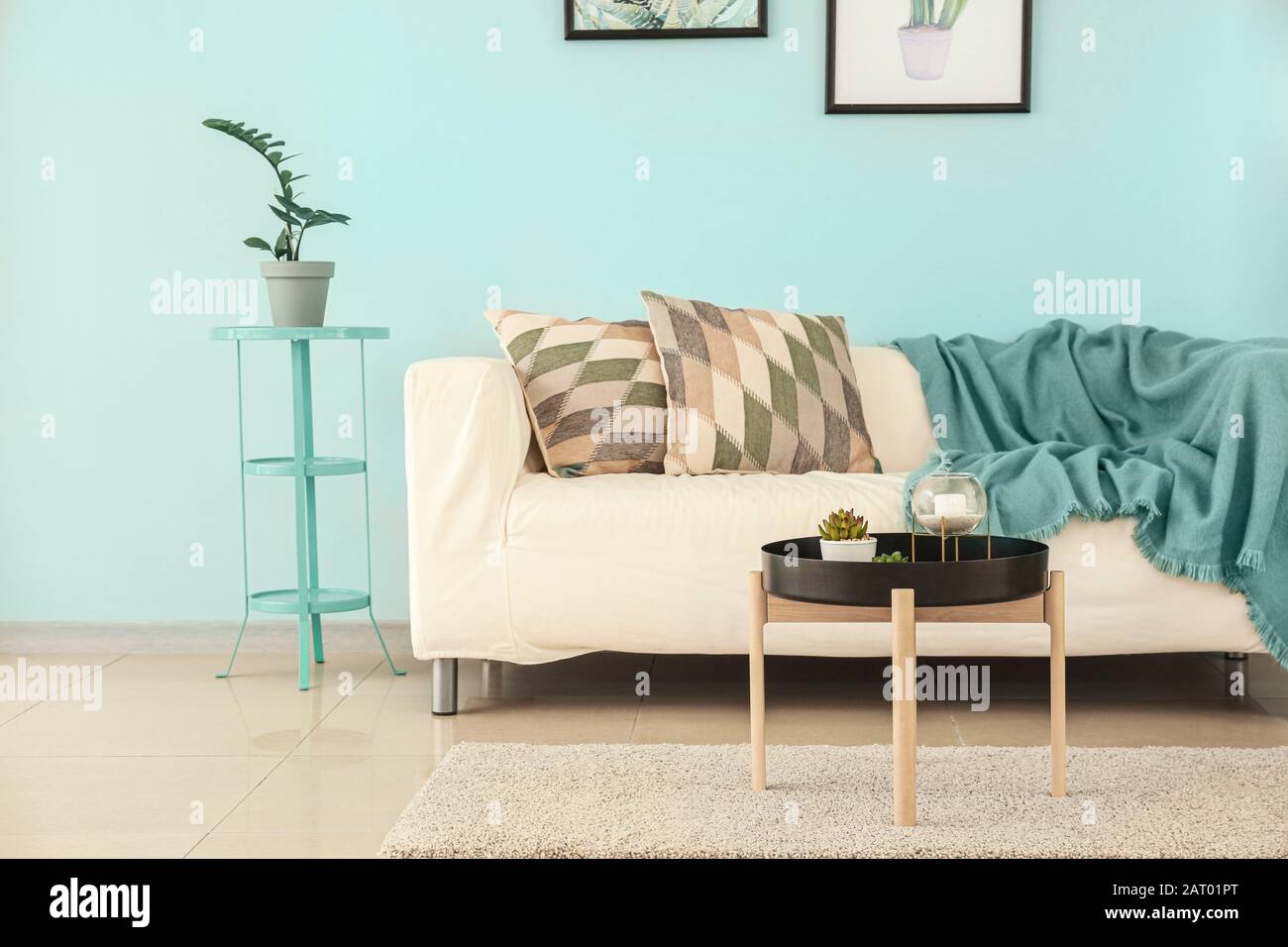 Interior of modern living room with turquoise elements Stock Photo - Alamy