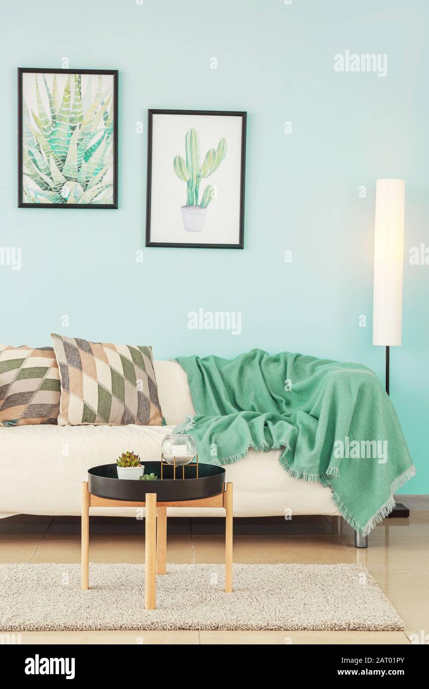 Interior of modern living room with turquoise elements Stock Photo - Alamy
