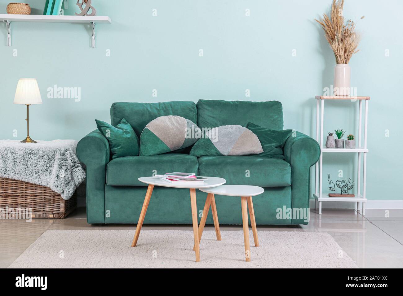 Interior of modern living room with turquoise elements Stock Photo - Alamy