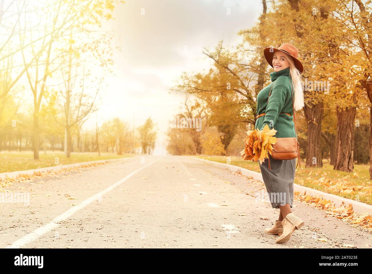 Beautiful mature woman in autumn park Stock Photo - Alamy