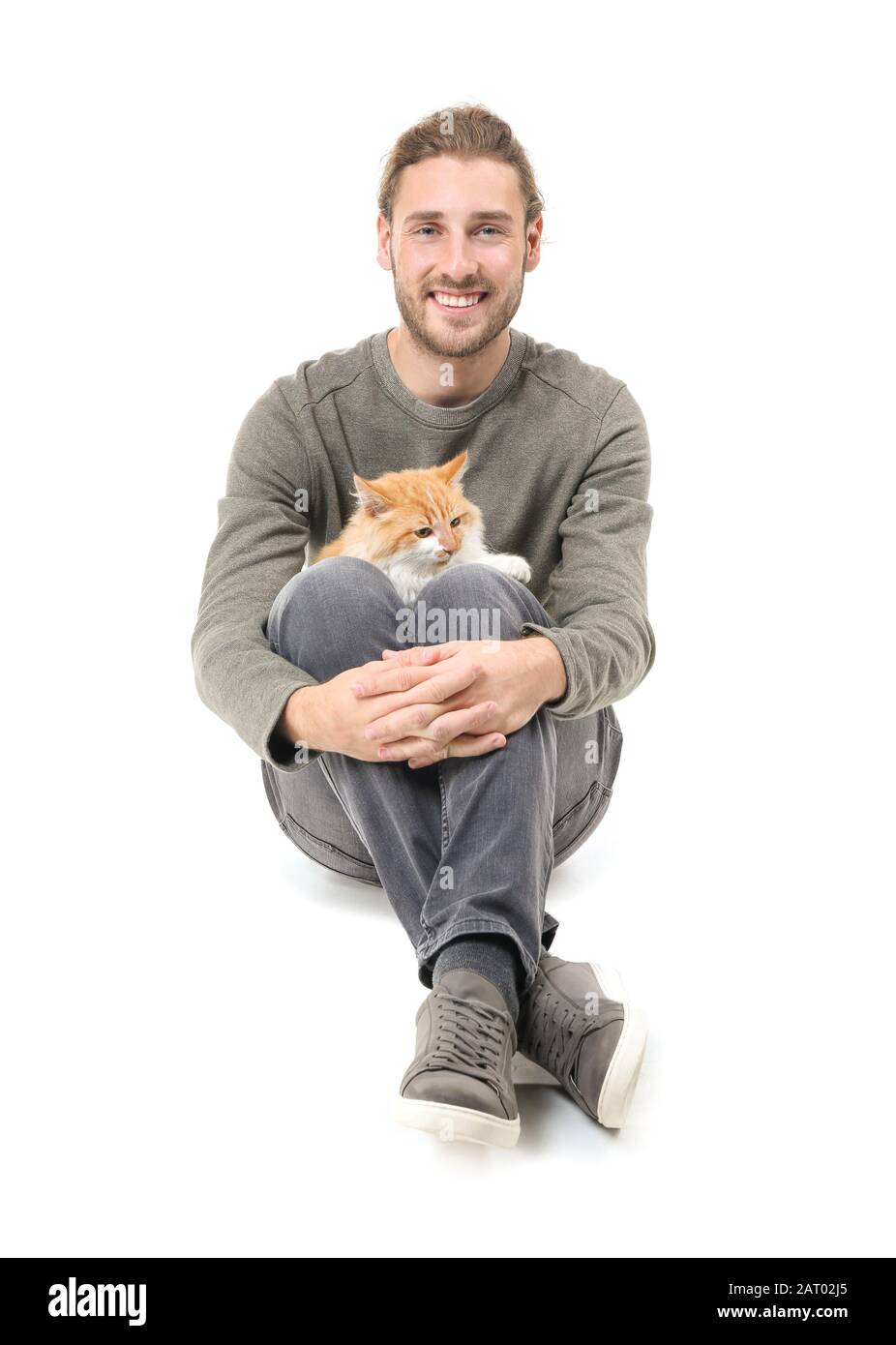 Man cat sitting on Cut Out Stock Images & Pictures - Alamy