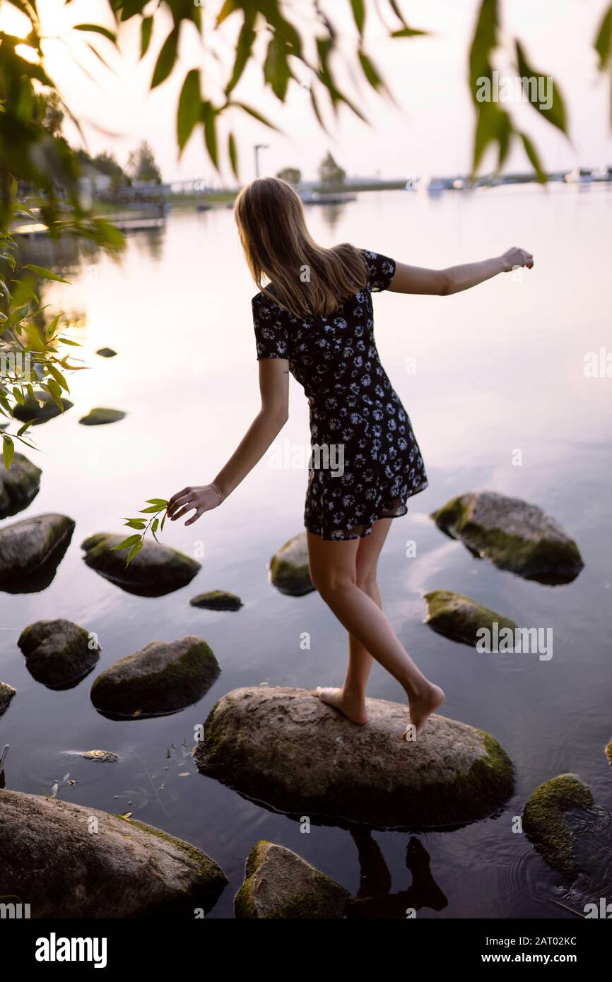 Balancing adult woman in hi-res stock photography and images - Alamy