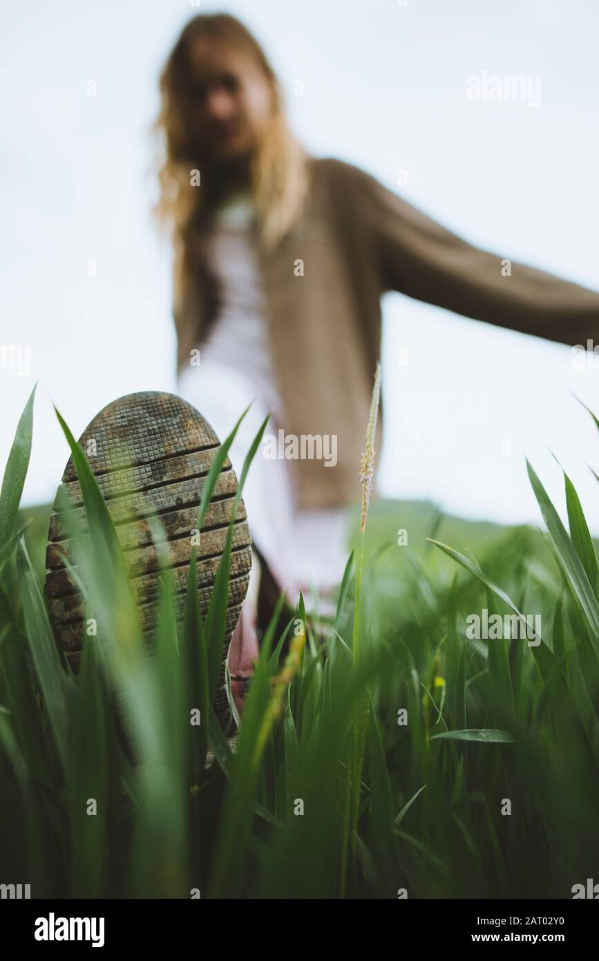 Woman kicking grass Stock Photo - Alamy