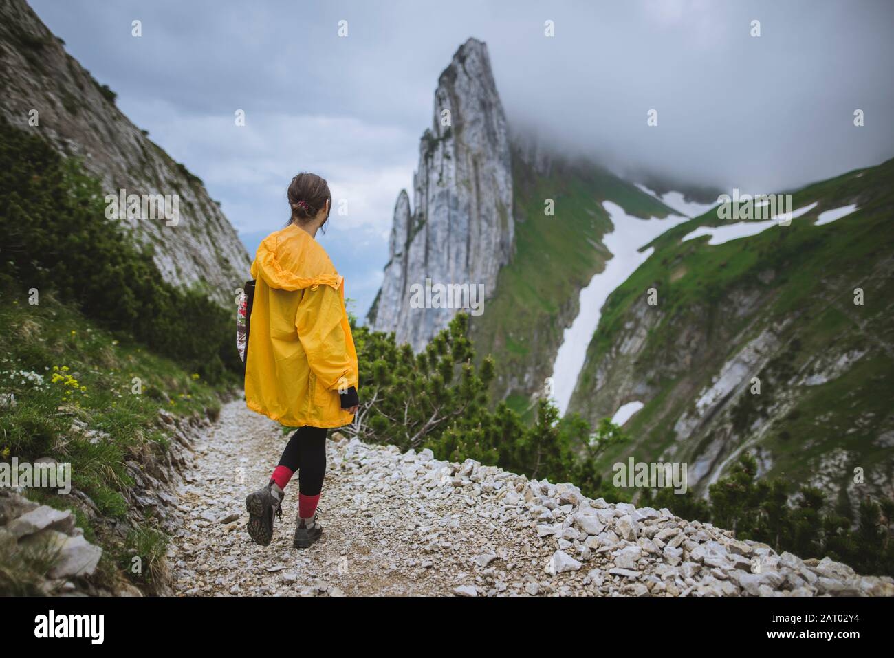 Woman wearing yellow jacket hi-res stock photography and images - Alamy