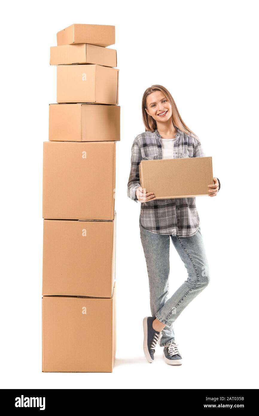 Young woman with moving boxes on white background Stock Photo - Alamy