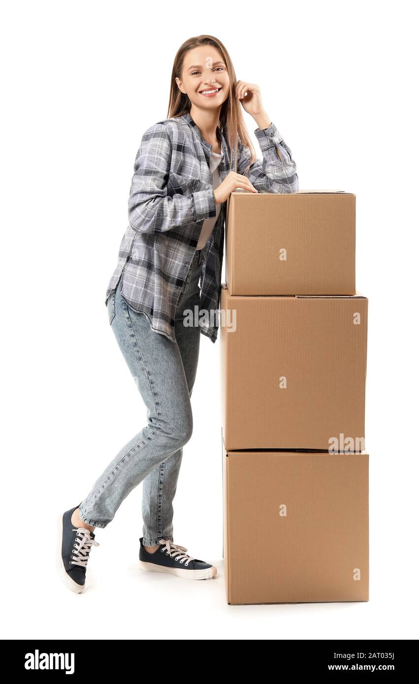 Young woman with moving boxes on white background Stock Photo - Alamy