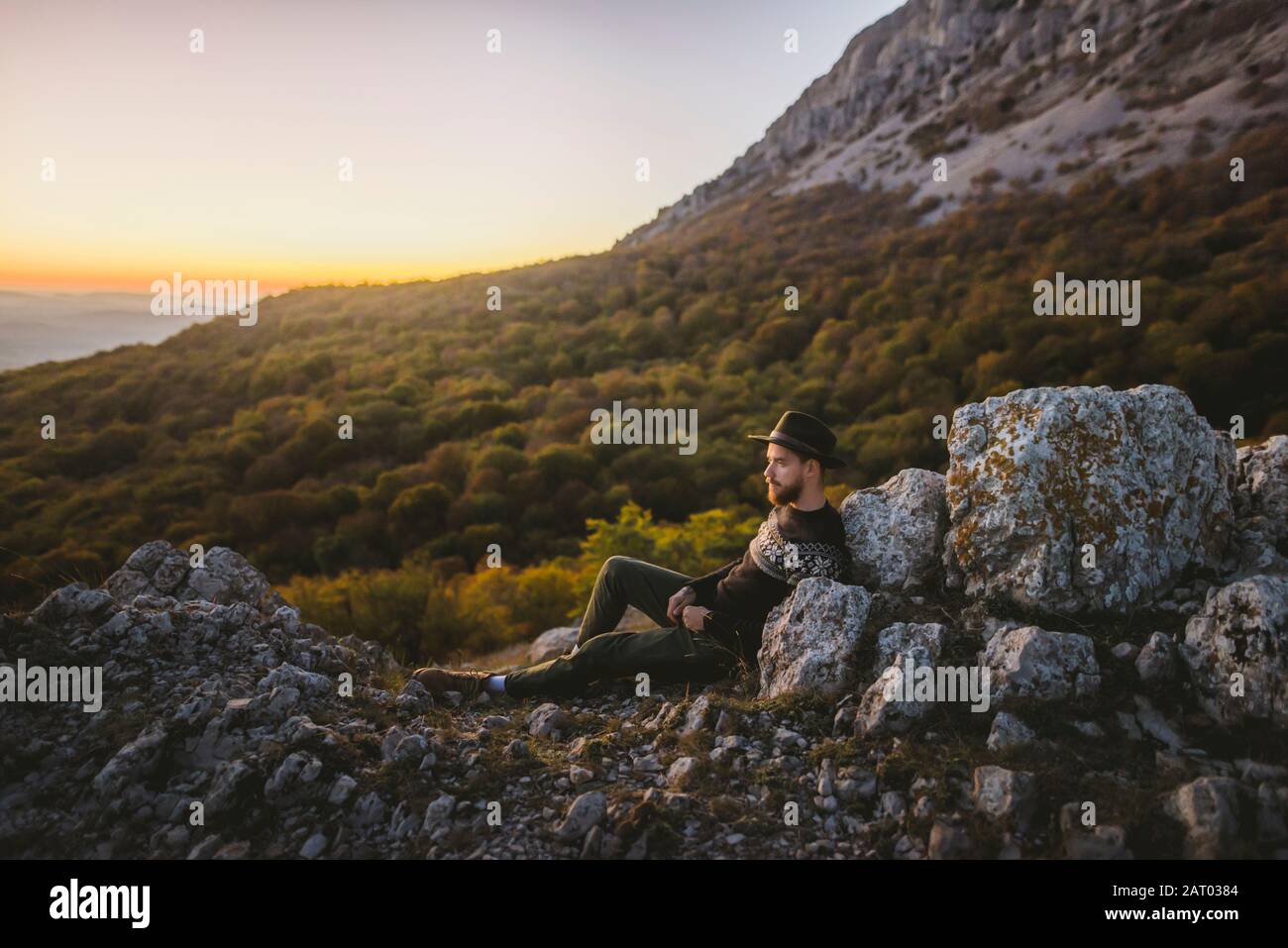 Young man lying rock hi-res stock photography and images - Alamy