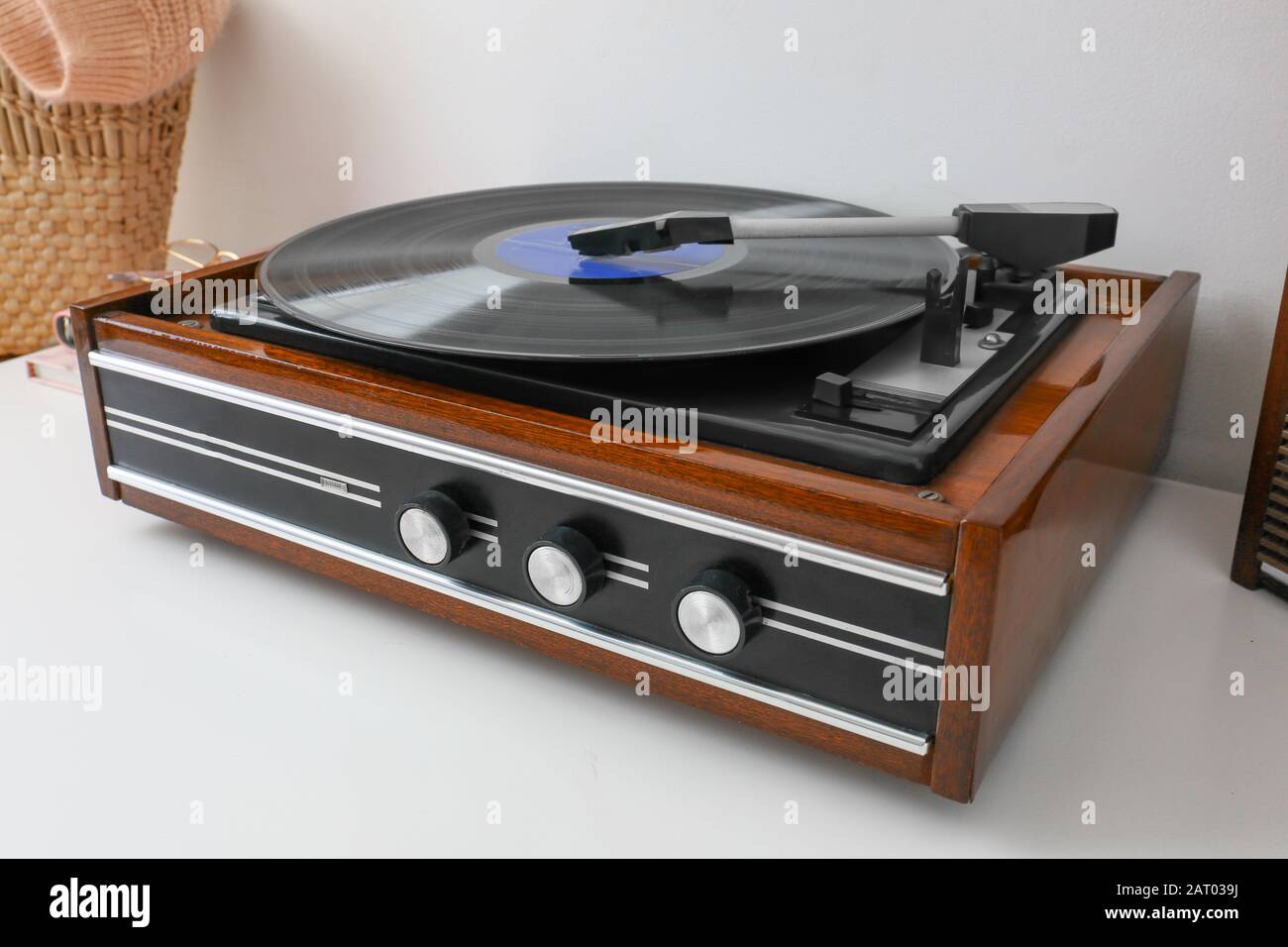 Record player with vinyl disc on table in room Stock Photo - Alamy