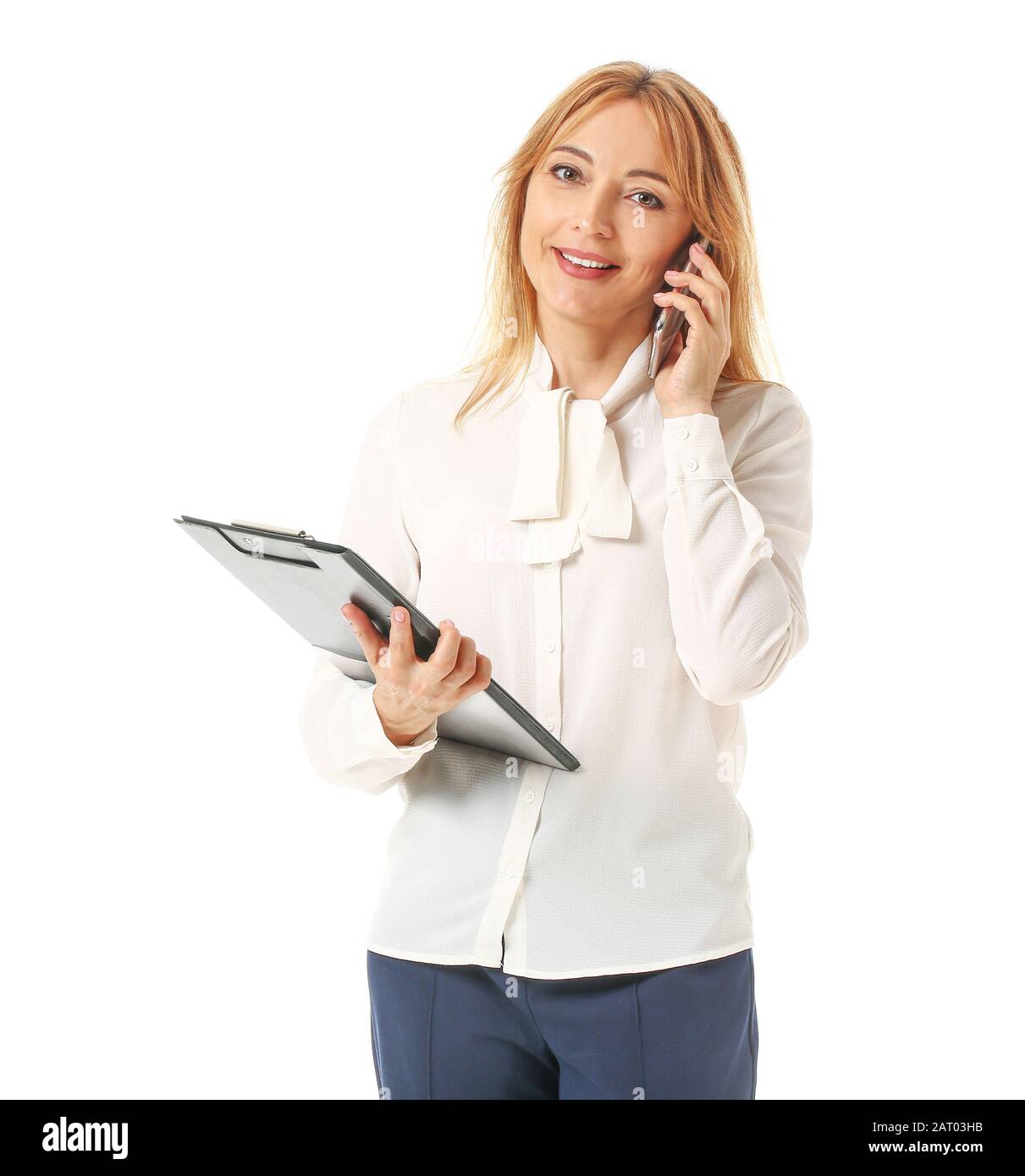 Female real estate agent talking by mobile phone on white background ...