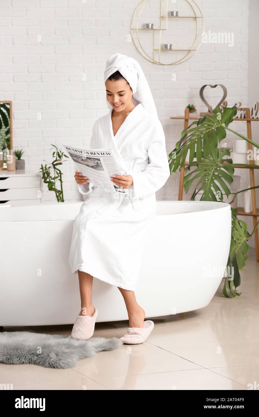 Woman reading newspaper in bathroom hi-res stock photography and images ...