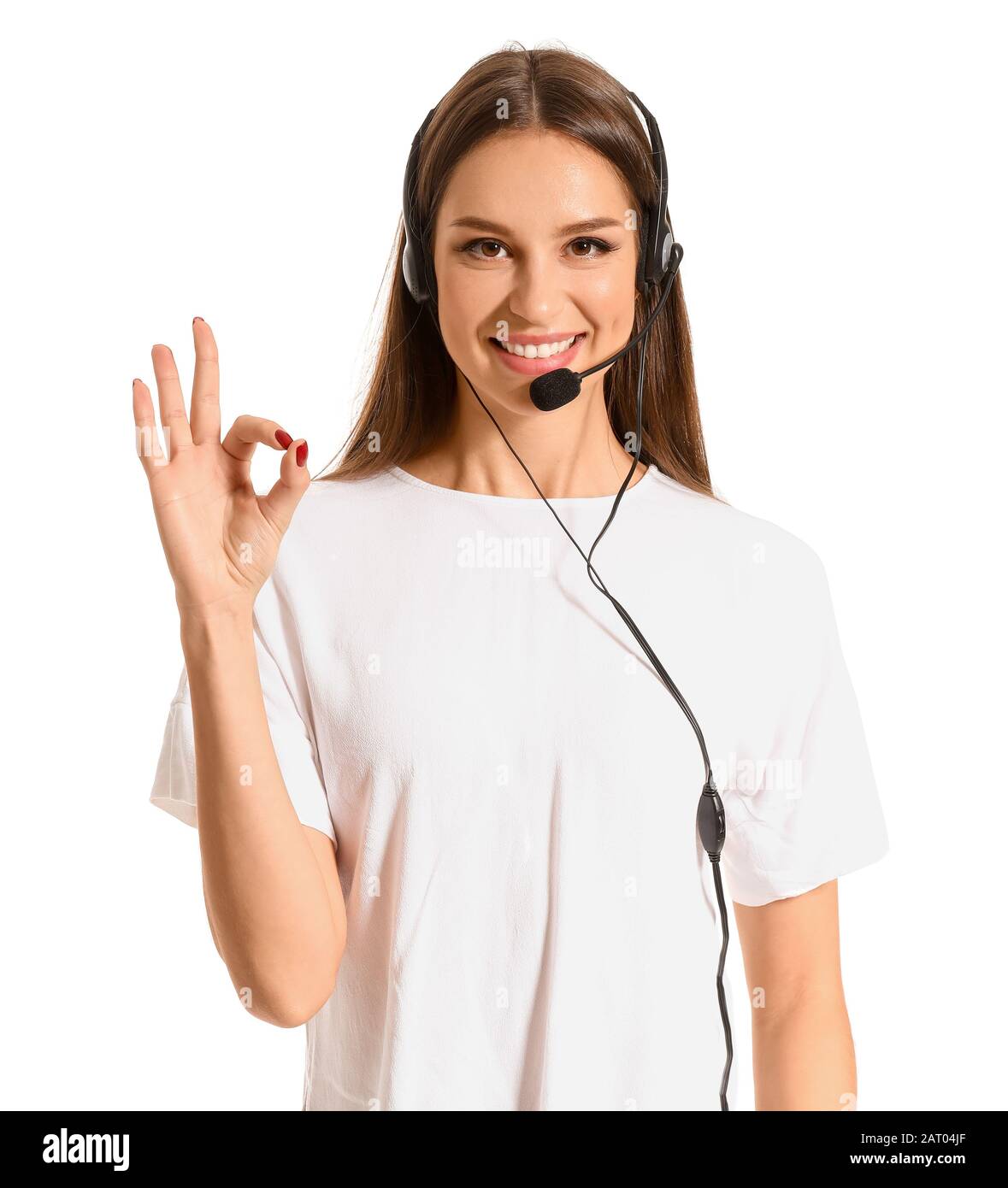 Female technical support agent showing OK gesture on white background ...