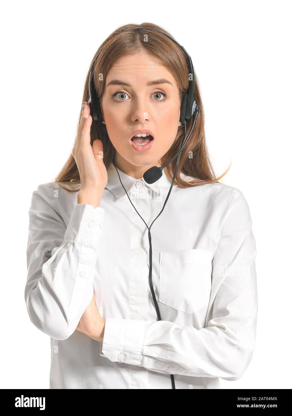 Shocked female technical support agent on white background Stock Photo ...