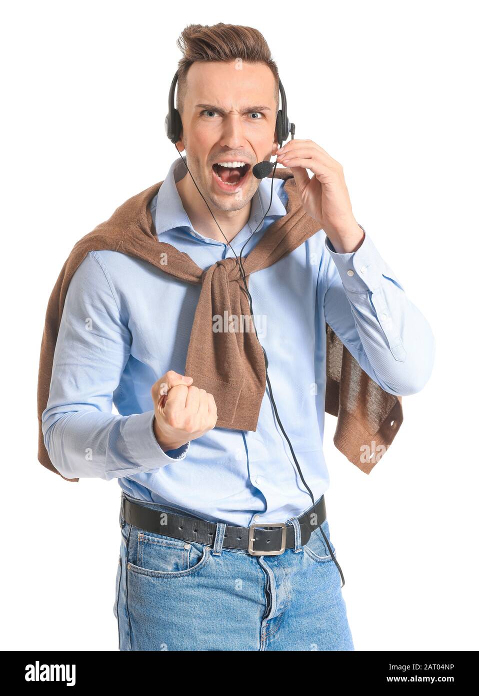 Angry male technical support agent on white background Stock Photo - Alamy