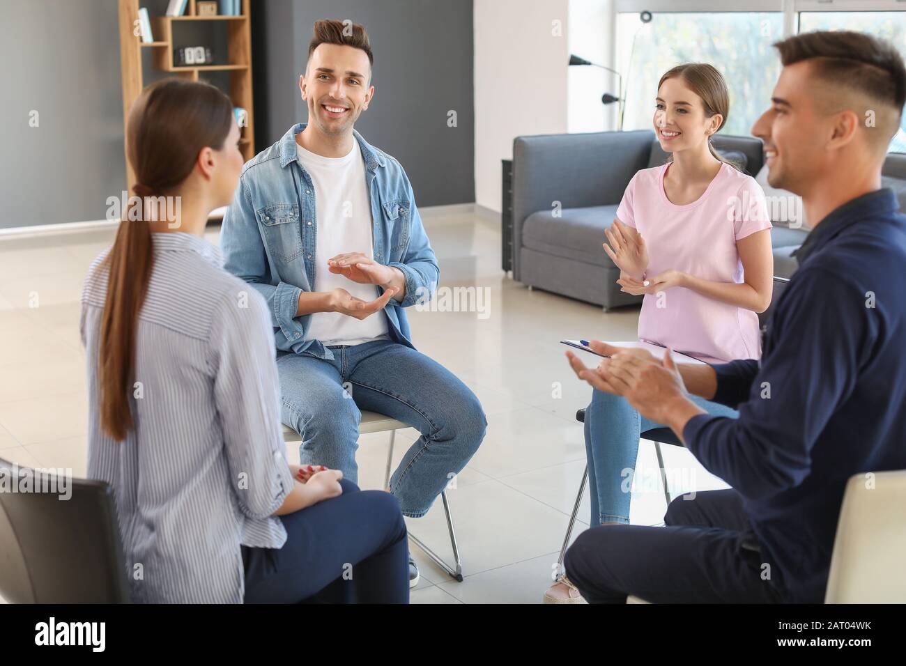 Group of young people during psychological support session Stock Photo ...