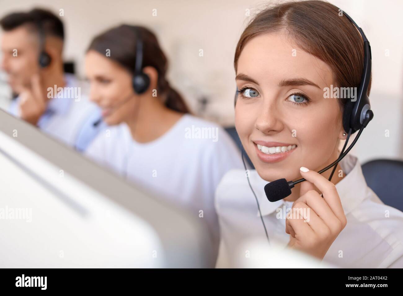 Female technical support agent working in office Stock Photo - Alamy