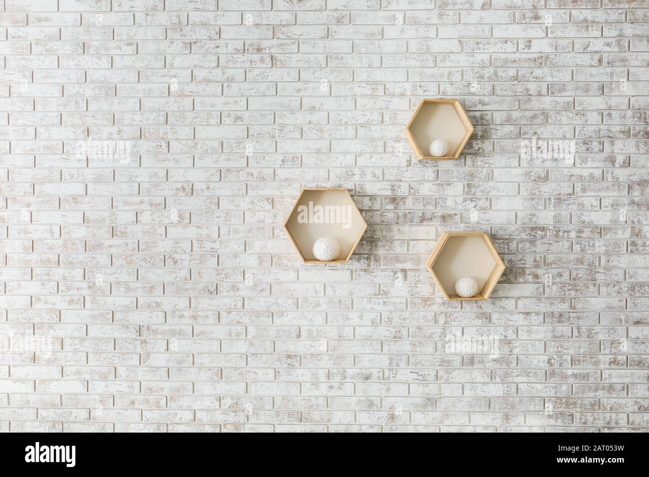 Hanging shelves on brick wall hi-res stock photography and images - Alamy