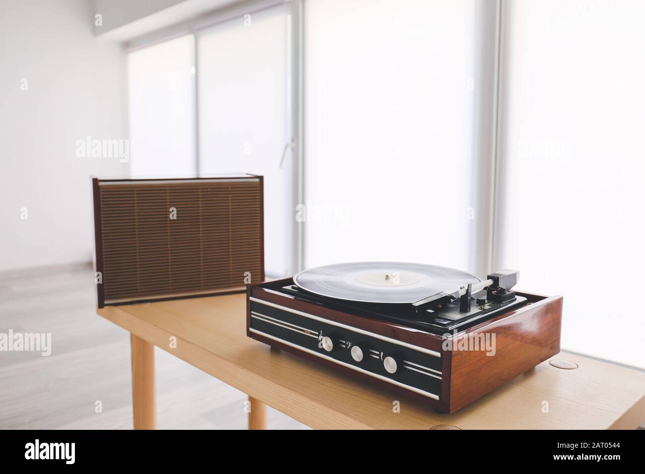Record player on table near window Stock Photo - Alamy