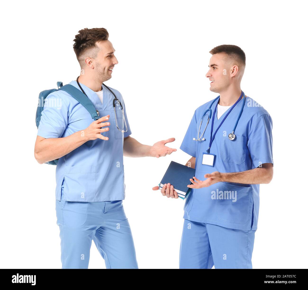 Male medical students on white background Stock Photo - Alamy
