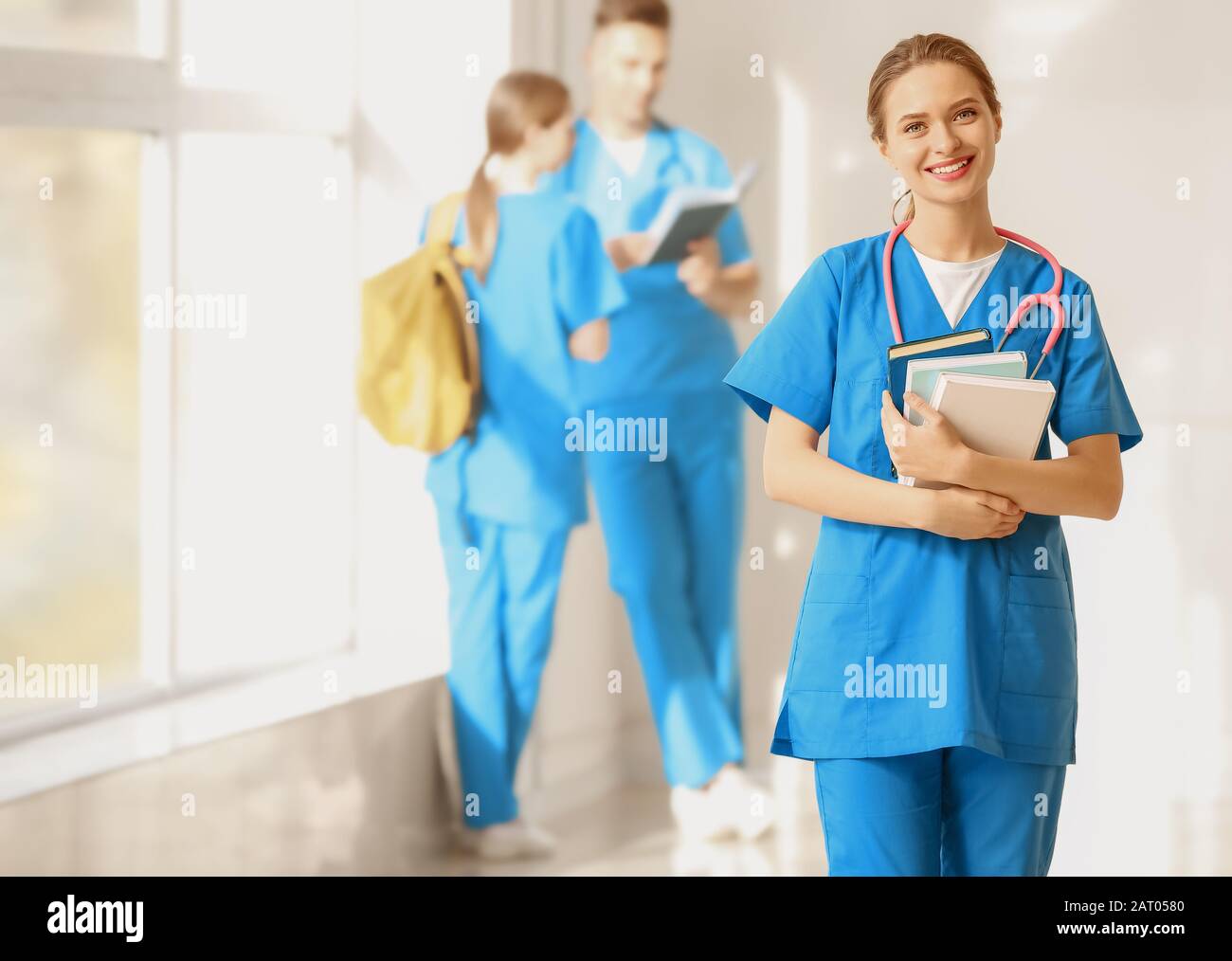 Female medical student in hall of clinic Stock Photo - Alamy