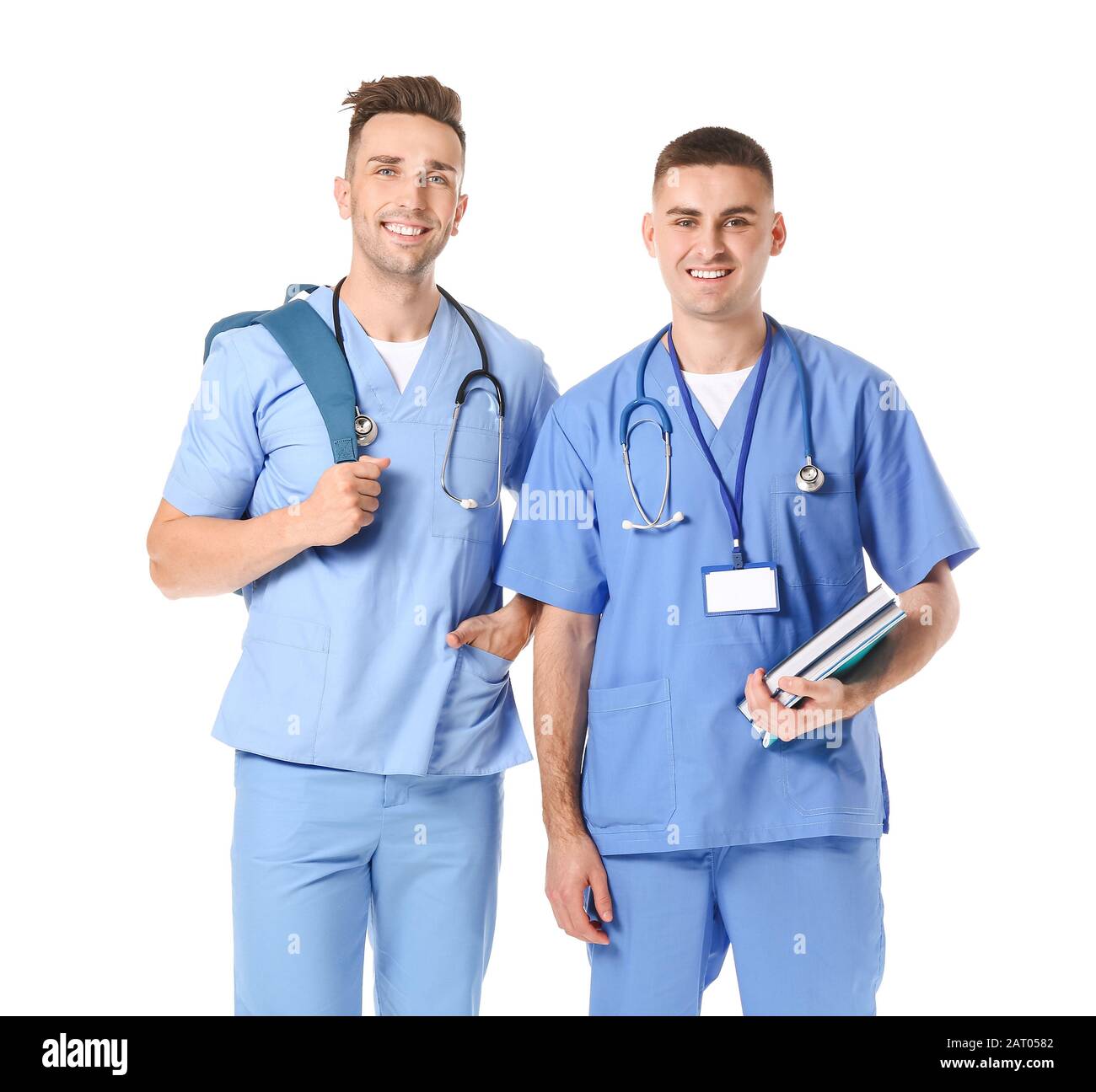 Male medical students on white background Stock Photo - Alamy