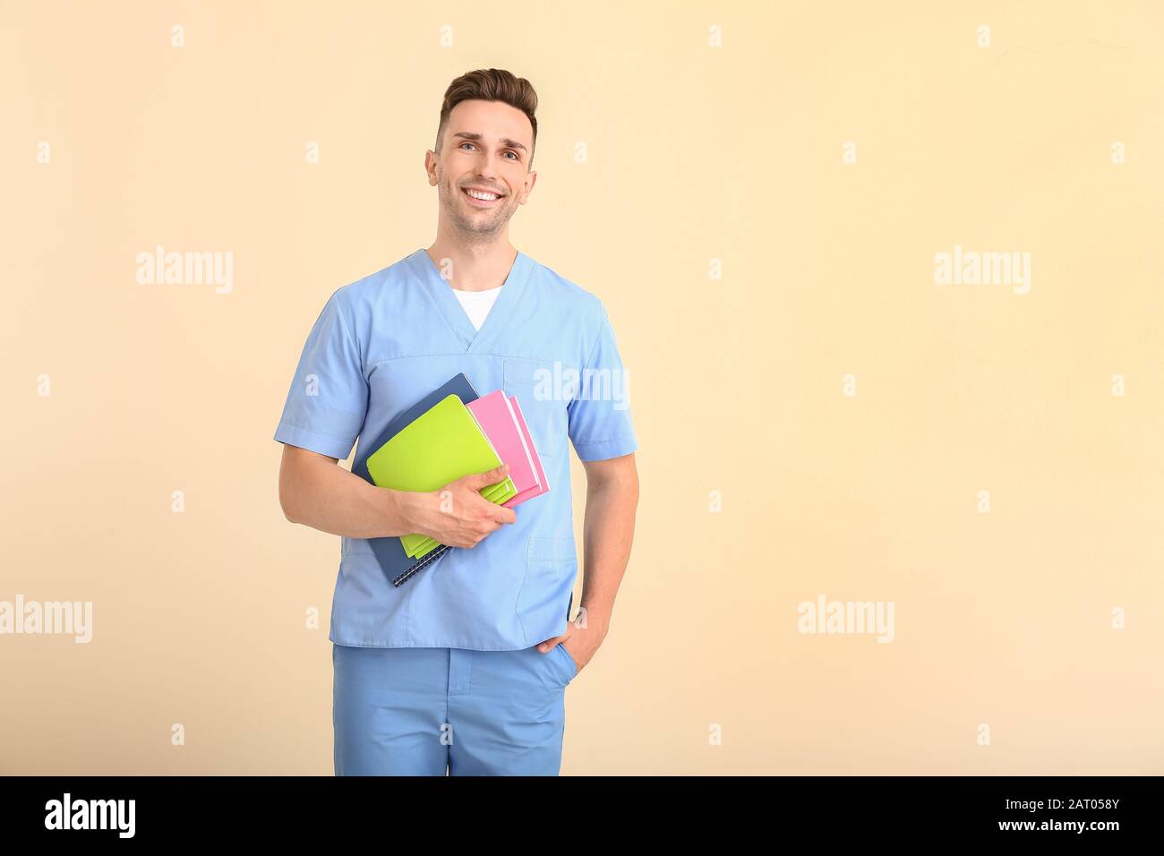 Male medical student on light background Stock Photo - Alamy