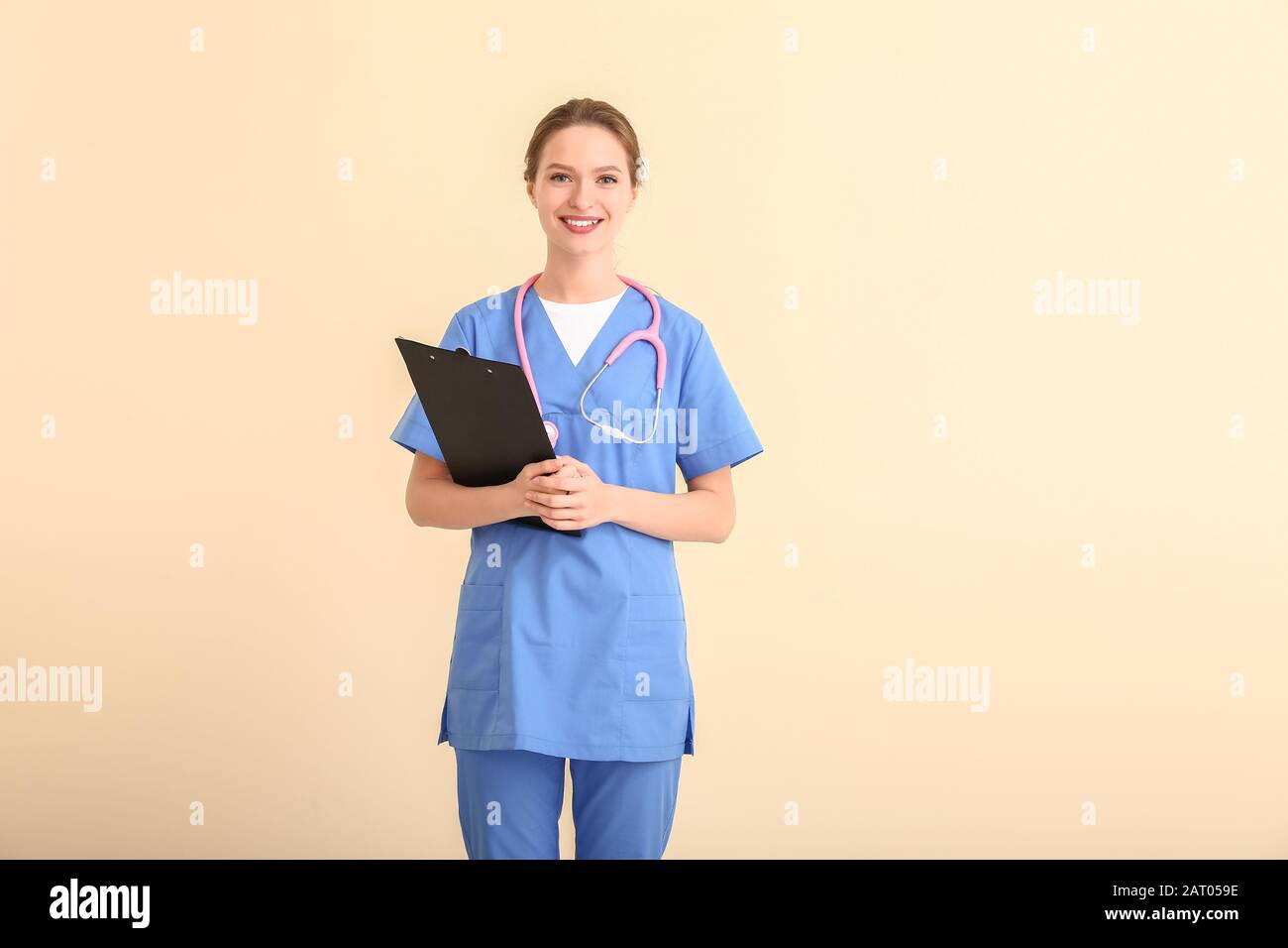 Female medical student on light background Stock Photo - Alamy